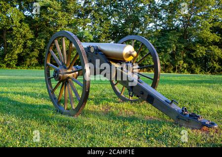 View of a 12 pounder field howitzer in the foreground and Parrott Gun ...