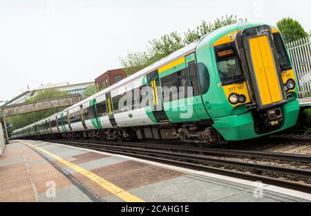 Class 377 passenger train in First Capital Connect livery speeding through the English ...