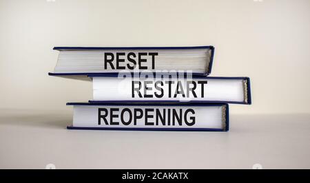 Books with text 'reset, restart, reopening' on beautiful white ...