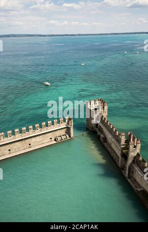 Backwater inside the Scaliger Castle - medieval port fortress, Sirmione ...