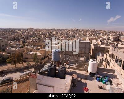 Rooftop water tanks are a common sight in the arid, sprawling city of ...