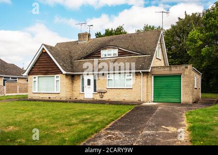 house with an eyelid shaped window in the roof Stock Photo - Alamy