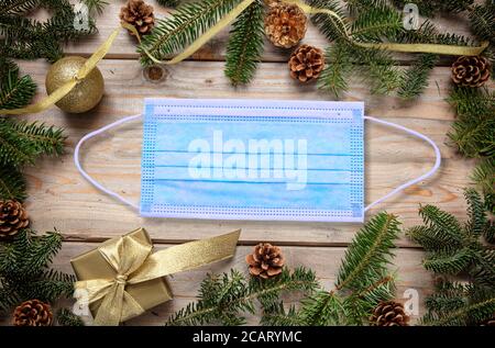 Coronavirus and Christmas 2020 concept. Face mask and festive items ...