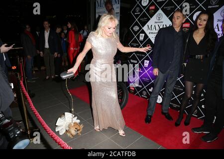 Christa Billich arrives on the red carpet for the Maxim magazine 5th ...