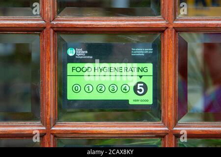 A Food Standards Agency rating sticker on a window of a restaurant in ...