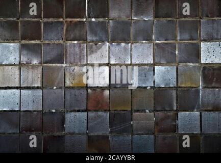 Dark opalescent ceramics tile surface with light reflections, graphic ...