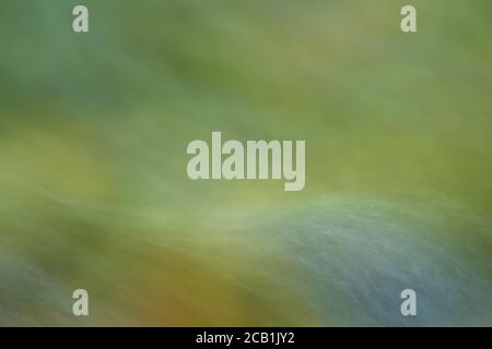 A light exposure stream of water over rocks Stock Photo - Alamy