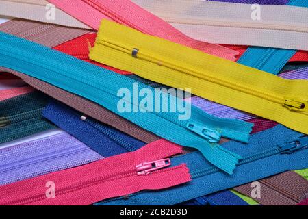 Colorful zipper for sewing and arrange as a background Stock Photo - Alamy