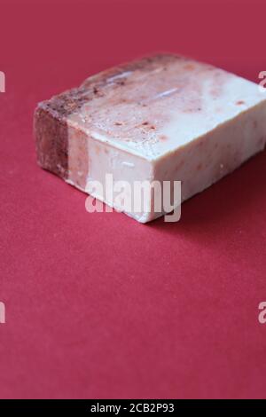 High angle view of handmade soap bars near dry flowers and supplies on ...