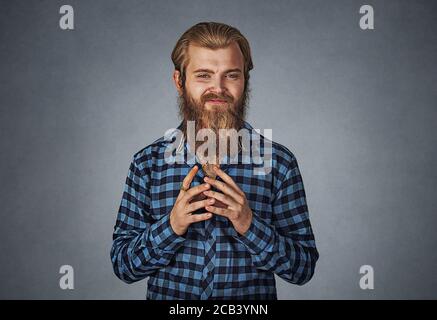 Cunning man plotting something isolated on white background. Young ...