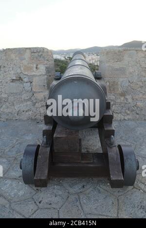 Vertical shot of a cannon in a fort Stock Photo - Alamy