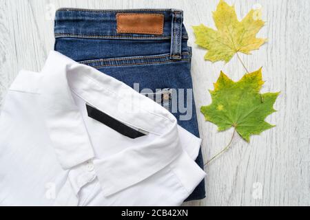 Classical white shirt, jeans and maple leaf. Fashionable concept Stock ...