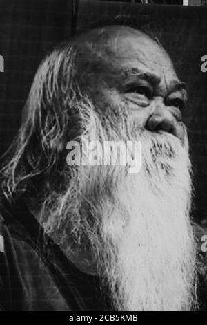 A portrait of Thai artist Thawan Duchanee on a golden sculpture inside ...