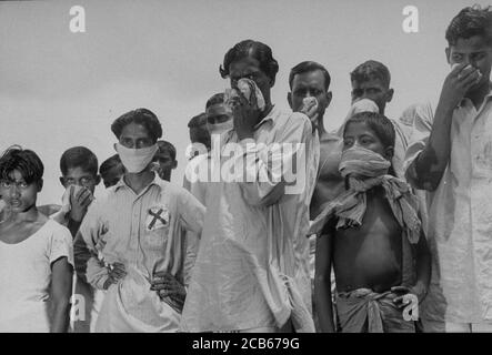 Old black and white photograph of decaying dead body / corpse of killed ...
