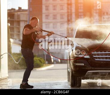 Window cleaner. close up of drops of spray for washing windows on glass ...