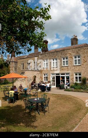 Visitors enjoying refreshments outside the Almonry Restaurant in the ...
