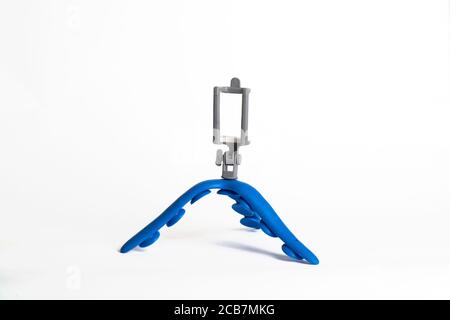 blue tripod tripod made of plastic and blue rubber on a white ...