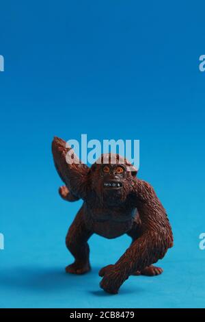 Closeup shot of a toy monkey on pink background Stock Photo - Alamy