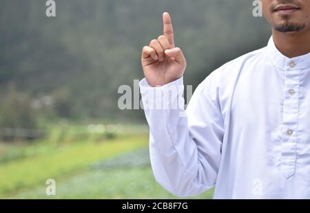 a man's hand with a tawhid symbol Stock Photo - Alamy