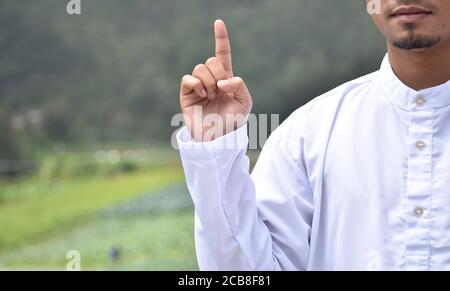 a man's hand with a tawhid symbol Stock Photo - Alamy