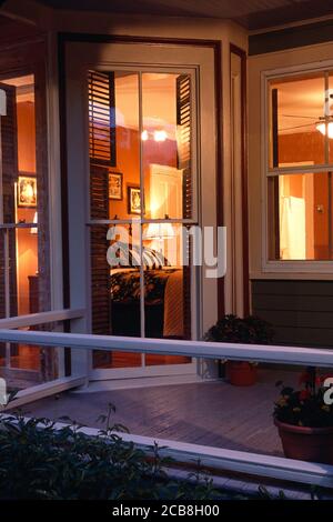 Residential home at night with lit windows, USA 1998 Stock Photo - Alamy