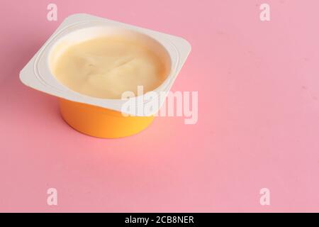 custard packed in plastic container Stock Photo - Alamy
