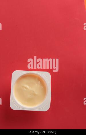 custard packed in plastic container Stock Photo - Alamy
