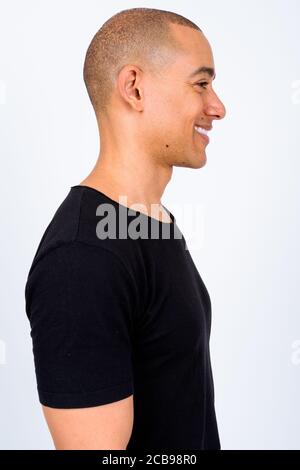 Profile view of happy handsome bald man looking at camera Stock Photo ...
