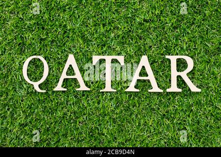 Alphabet letter with word qatar in black line hand drawing as bubble ...