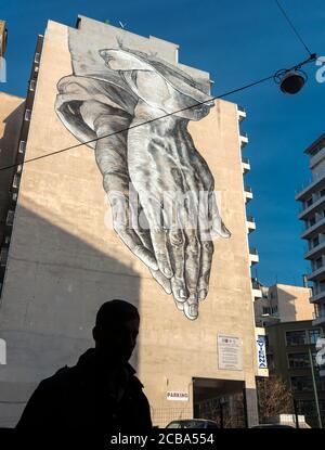 Praying hands graffiti at Athens Greece Stock Photo - Alamy
