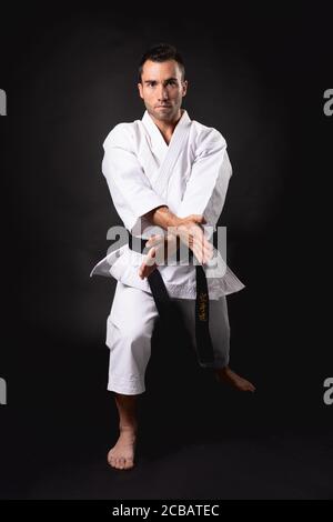 karateka practicing kata with black background Stock Photo - Alamy