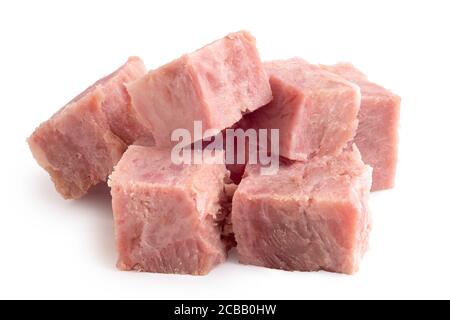 Cut up squares of premium canned ham in a black ceramic bowl. High ...