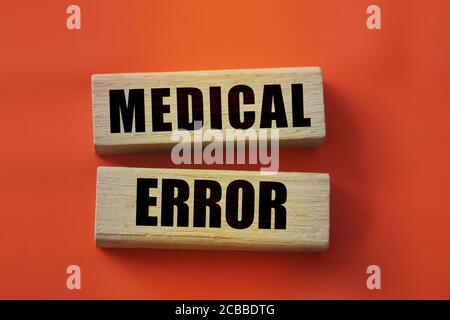Medical error text on wooden blocks on red. Healthcare concept Stock ...