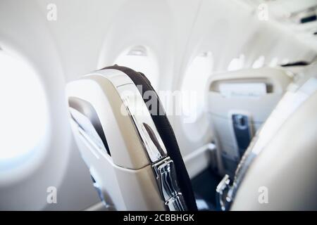 (Selective focus) Airplane window and empty seat. Night flying, concept ...