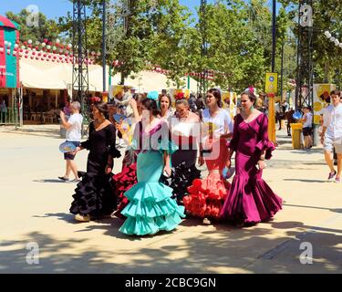 Spanish women in traditional Spanish feria dress prior to festival ...