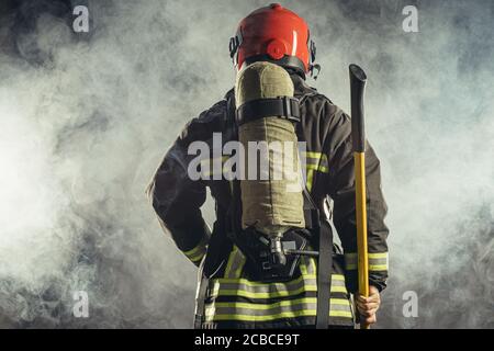 Fire brigade safety officer wearing tabard attending an incident at ...