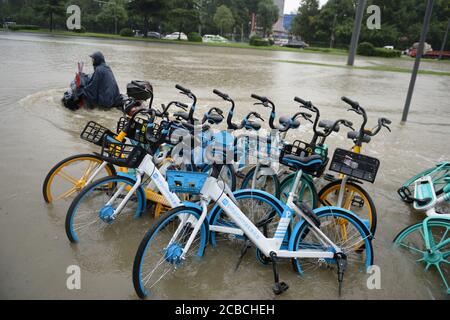 Chengdu, China. 11th Aug, 2020. The street was flooded by a heavy rain ...