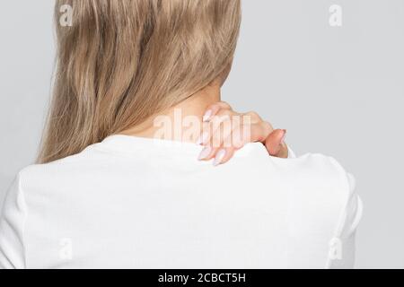 Nape pain closeup. Ache in back neck. Man suffering from injury, strain ...