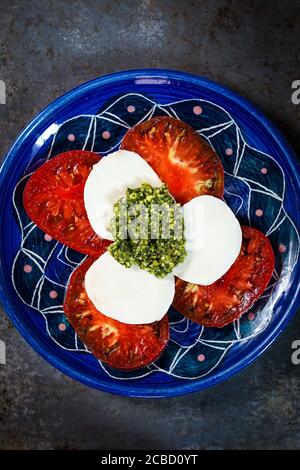 Delicious caprese salad with ripe colorful tomatoes and mozzarella ...