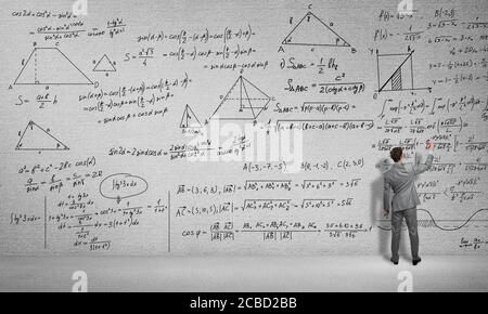 Man draw science formulas Stock Photo - Alamy