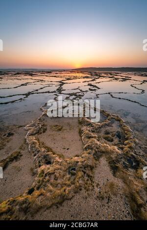 Seascape of Vila Nova Milfontes during low tide, at sunset Stock Photo ...
