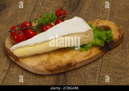 Brie cheese triangle served salad leaves Stock Photo - Alamy