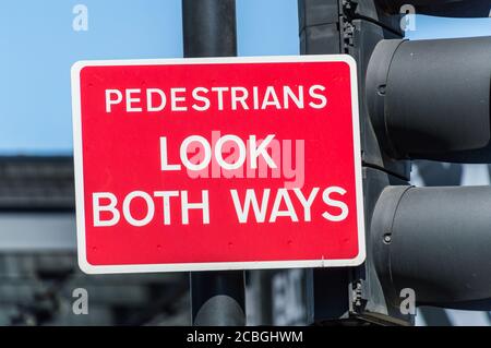 Look both ways before crossing sign next to pedestrian crossing, Falls ...