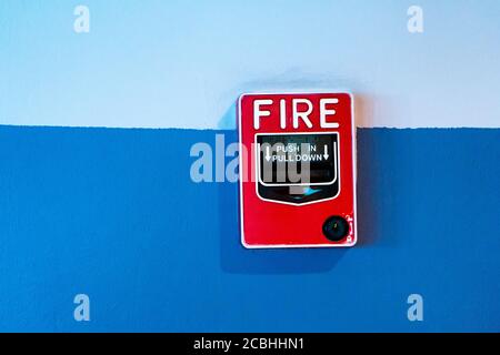 Red button handbrake fire alarm on the wall Stock Photo - Alamy