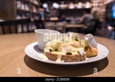Substantial breakfast with fried egg, salad, bread and coffee, top view ...