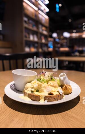 Substantial breakfast with fried egg, salad, bread and coffee, top view ...