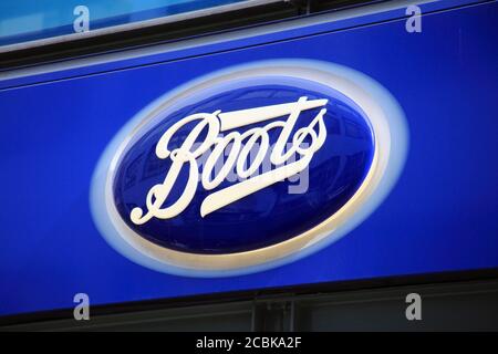 Boots the chemist advertising sign outside one of its retail stores in ...