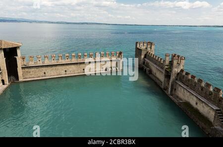 Backwater inside the Scaliger Castle - medieval port fortress, Sirmione ...