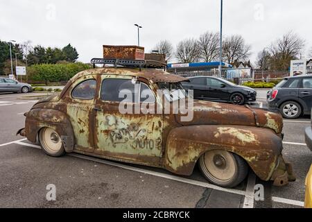 rusty old Lincoln car and Ford truck in a junk yard in the desert in ...