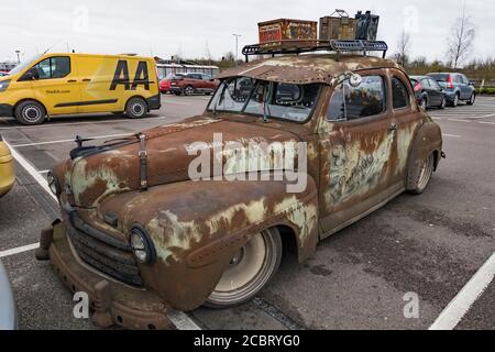 rusty old Lincoln car and Ford truck in a junk yard in the desert in ...